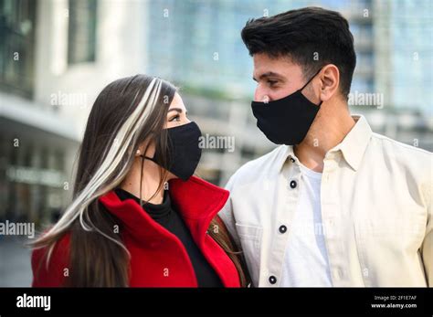 Romantic Happy Couple Looking Deeply In Each Others Eyes Wearing Masks