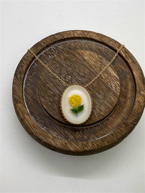 1970s Acrylic Resin Encased Yellow Flower Oval Pend Gem