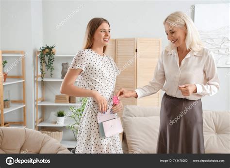 Mother Putting Condom Her Daughters Bag Home Sex Education Concept