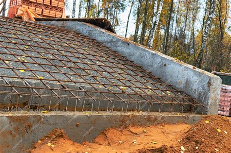 Premium Photo Installation Of Reinforcement And Formwork For Reinforced Concrete By Builders