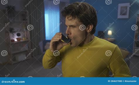 A Man Uses An Asthma Inhaler In The Living Room At Home Close Up A Man Takes Out An Inhaler