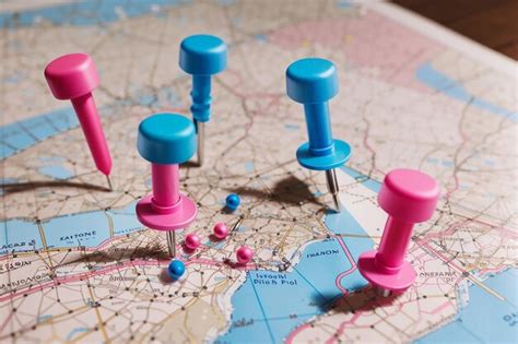 Premium Ai Image Pink And Blue Pushpins Showing Marking Location On Map