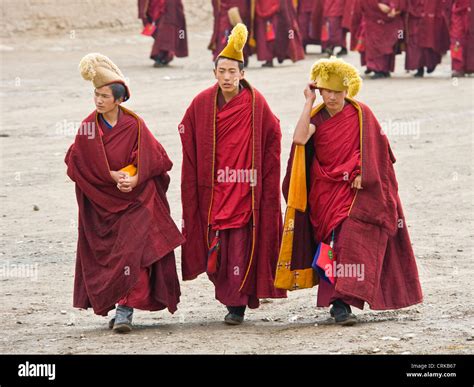 Tibetan Buddhist Monks Geluk Or Yellow Hat On Their Way To Prayer In