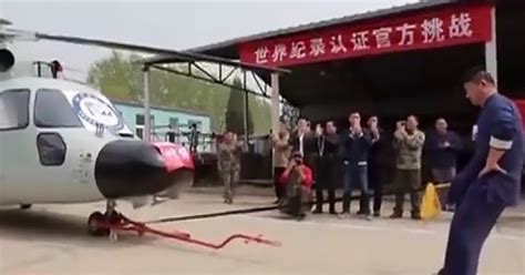 Latest Updates Man Tows Helicopter With Penis Breaks Record