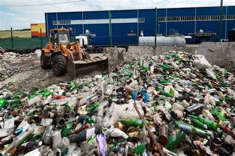 The Bucket Loader Breaks Glass Bottles By Dumping Them Out Of The