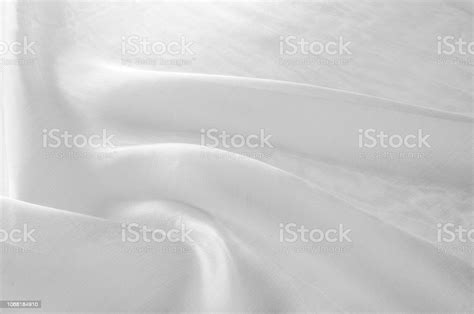 배경 질감 패턴입니다 직물은 흰색입니다 우아하고 섬세 한 화이트 실크 직물 배경입니다 밝은 공단 직물 배경으로 사용 하기 위해 접혀 직물 섬유 표면의 위 유형입니다 0명에