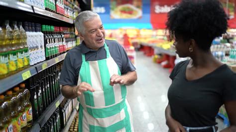 Supermarket Assistant Helping Customer Videos And Hd Footage Getty Images