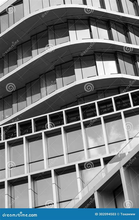 Monochrome Architecture Curved Lines Of A Modern Building Facade Pattern Of Windows And