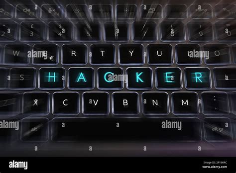 Hacker Written On The Keys Of A Laptop Backlit Keyboard Internet Data Safety Concept Stock