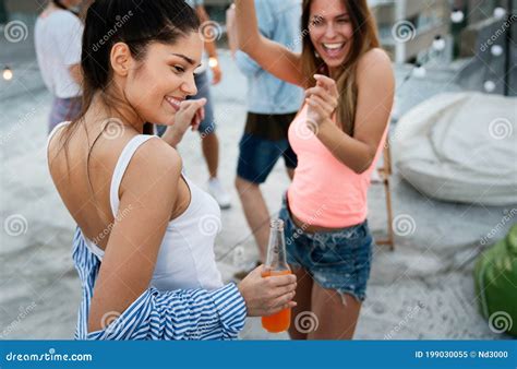 Group Of Happy Young People Friends Dancing And Having Fun In Party