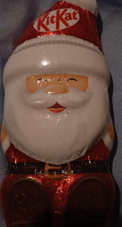 Шоколад Kit Kat Санта зі злаковими пластівцями та шматочками печива з корицею Kit Kat