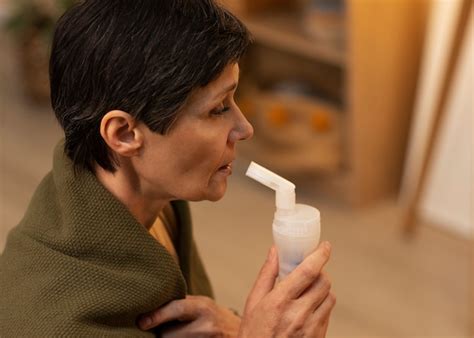 Free Photo Side View Woman Using Nebulizer