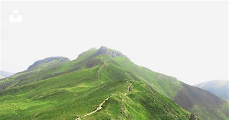 Green Grass Covered Mountain Photo Free Cantal Image On Unsplash