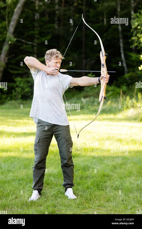 Man Aiming Bow Arrow Man Hi Res Stock Photography And Images Alamy