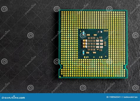 The Microprocessor Processor Of The Cpu Of A Computer Or Laptop Lies On A Dark Matte Surface