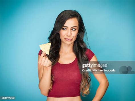 Female Eating Chips Photos And Premium High Res Pictures Getty Images