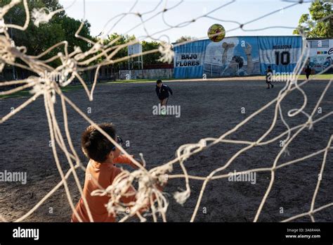 Alexis Lara Strikes A Soccer Ball To His Friend Yamil Manrique Tending