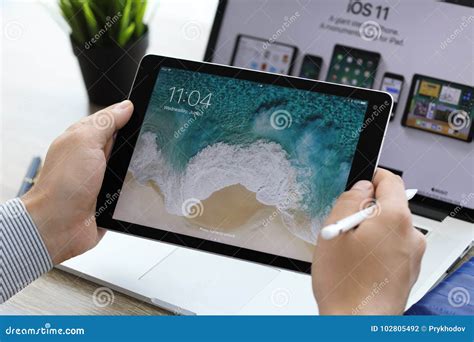 Man Hand Holding IPad Pro With IOS On The Screen Editorial Photography Image Of Device