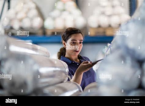 Female Scanning Item In Distribution Warehouse Stock Photo Alamy