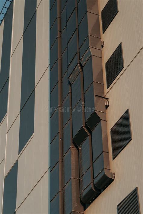 Facade Of A New Building With Four Vertical Ventilation Ducts And Air