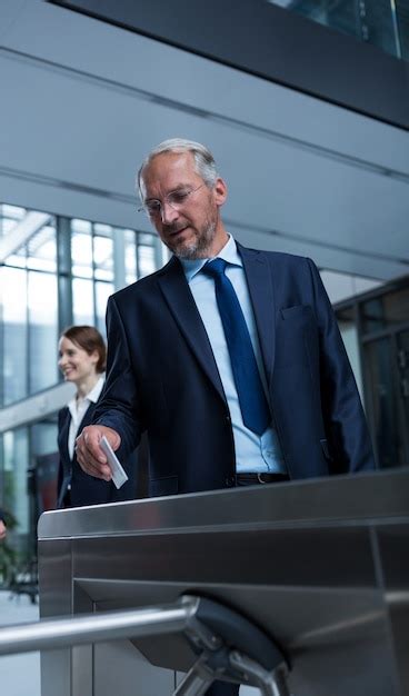 Premium Photo Businessman Scanning His Card At Turnstile Gate