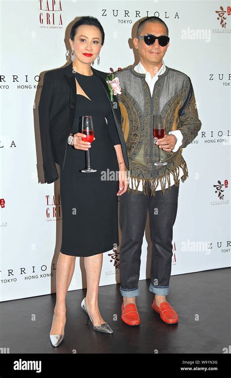 Hong Kong Actor Tony Leung Chiu Wai Right And His Actress Wife Carina Lau Propose Toasts