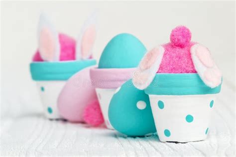 Cute Easter Decorations The Bunny In The Flower Pot And Handmade Easter Eggs Stock Image