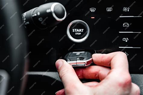 Premium Photo Hand Insert Car Keyless Remote In A Keyhole In A Car
