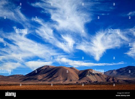 Unusual Funnel Shaped Cirrus Cloud Formations On The Border Of The