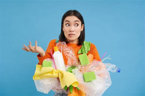 Korean Girl With Plastic Garbage Shrugs Shoulders Doesnt Know How To
