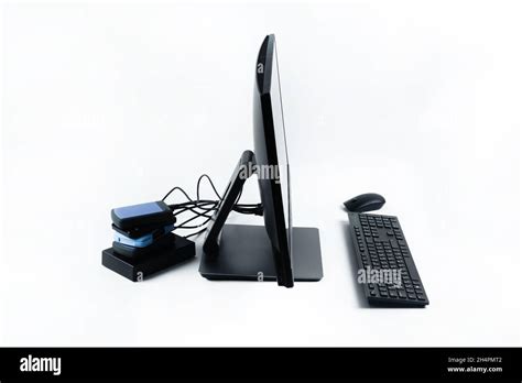 Multiple External Hard Drives Connected To A Monoblock On A White Background Computer With Hard