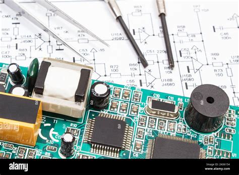 Printed Circuit Board With Transistors Resistors Capacitor Precision Tools And Diagram Of