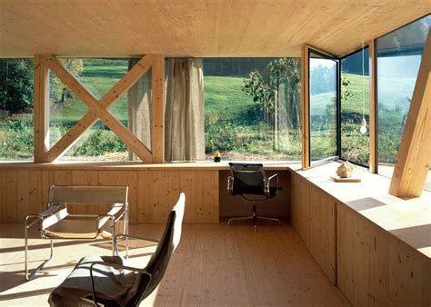 Swiss House By Pascal Flammer With Wooden Braces And A Circular Window