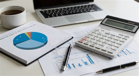 Financial Analysis Workspace With Calculator Charts And Laptop