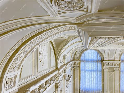 Premium Photo An Elegant Ceiling Adorned With Detailed Molding And