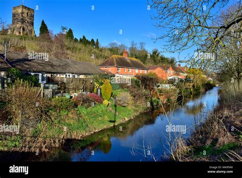 River Salwarpe With Houses Next To It And Near Vines Park In Droitwich