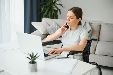 Premium Photo Female Freelance Programmer Sitting In Wheelchair And