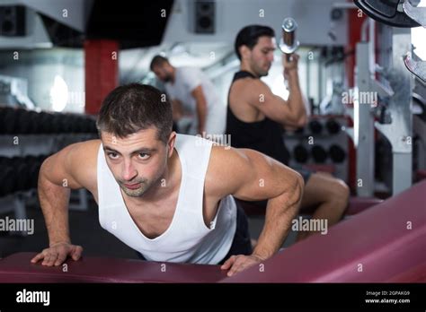 Man Doing Push Ups On Bench In Gym Stock Photo Alamy