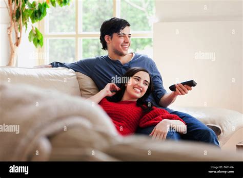 Couple On Couch Watching Tv