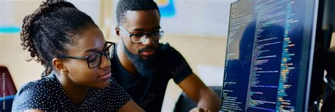 In This Image A Young Team Collaborates On Coding At A Computer Station Showcasing The Dynamic