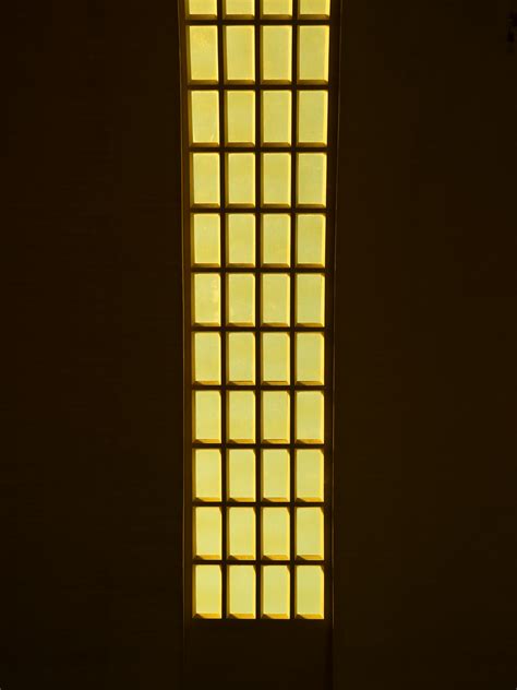 A Rectangular Window With Yellow Light Shines Photo Free Abstract