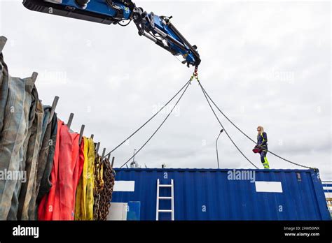 Woman Assisting With Carrying Cargo Container Stock Photo Alamy