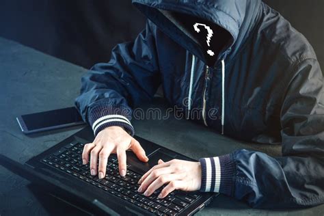 Anonymous Hacker Programmer Uses A Laptop To Hack The System St Stock Image Image Of Danger