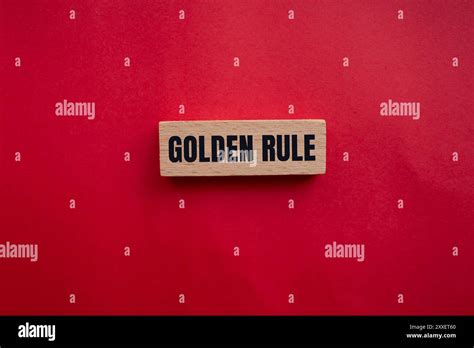 Golden Rule Message Written On Wooden Block With Redbackground