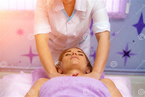Relaxing Massage European Woman Getting Facial Massage In Spa Salon