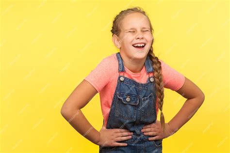 Premium Photo Happy Girl Standing Against Yellow Background