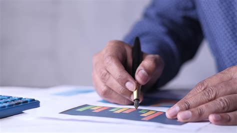 Businessman Analyzing Financial Data At Office Desk 21858793 Stock Video At Vecteezy