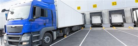 Loading Dock Of Large Warehouse With Blue Cabin Truck Under Loading Stock Photo Adobe Stock