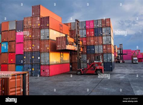 Container Loading And Unloading Equipment In The Harbor Import And Export Concept Stock Photo