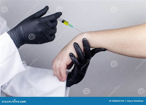 An Orthopedic Surgeon Gives An Injection In The Wrist Treatment Of An Orthopedic Surgeon Gives An Injection In The Wrist Treatment Of